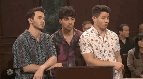 Nick Jonas Shrug GIF by Saturday Night Live - Find & Share on GIPHY