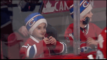 Hockey player tosses souvenir puck to make young fan's day : r/gifs