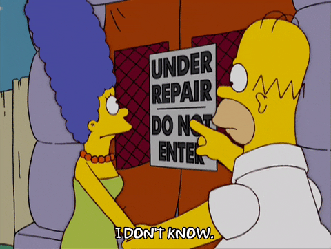 Pointing To Sign Homer Simpson GIF - Find & Share on GIPHY